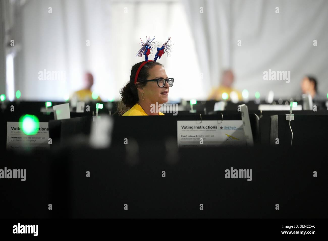 Tina Taylor works at a vote center set up in a tent in Las Vegas ...