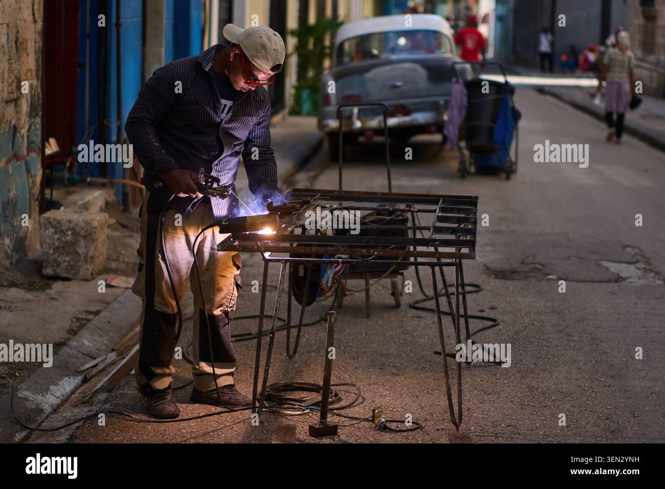 A blacksmith welds a door in Havana, Cuba, Tuesday, June 9, 2026. (AP ...