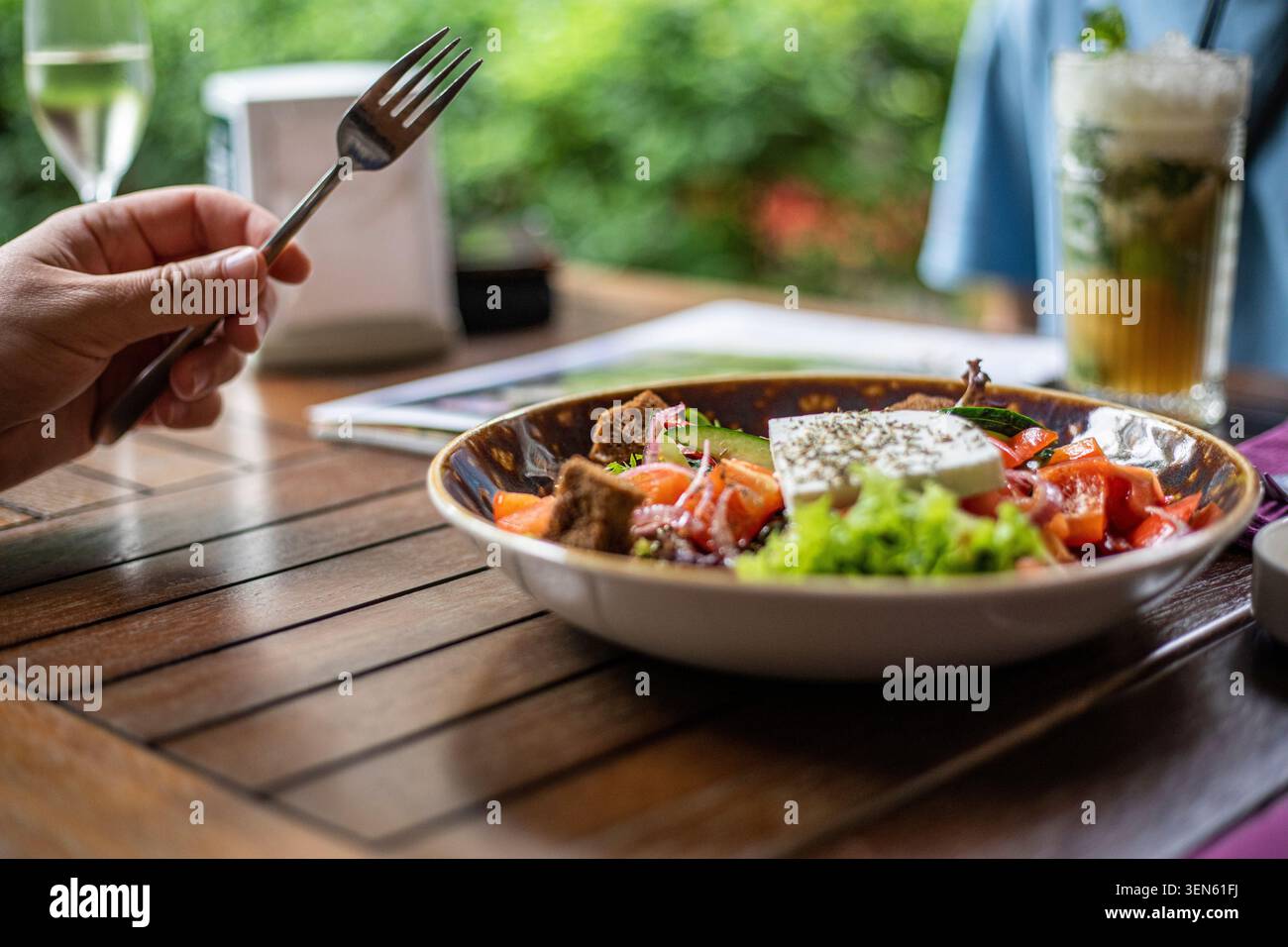 Greek salad with feta cheese and pieces of dried rye bread Stock Photo ...