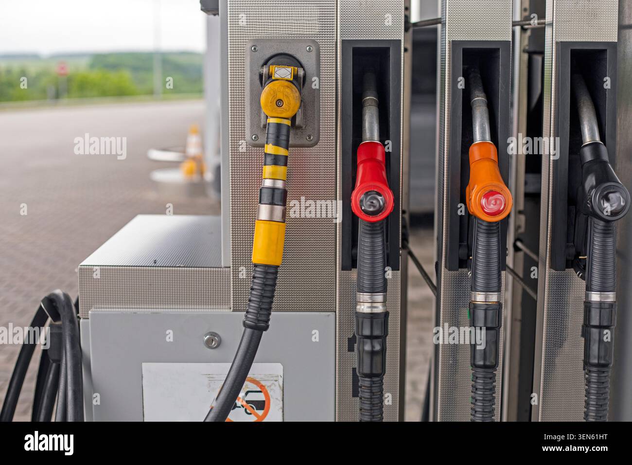Gas nozzles at a gas station. Rising oil prices Stock Photo - Alamy