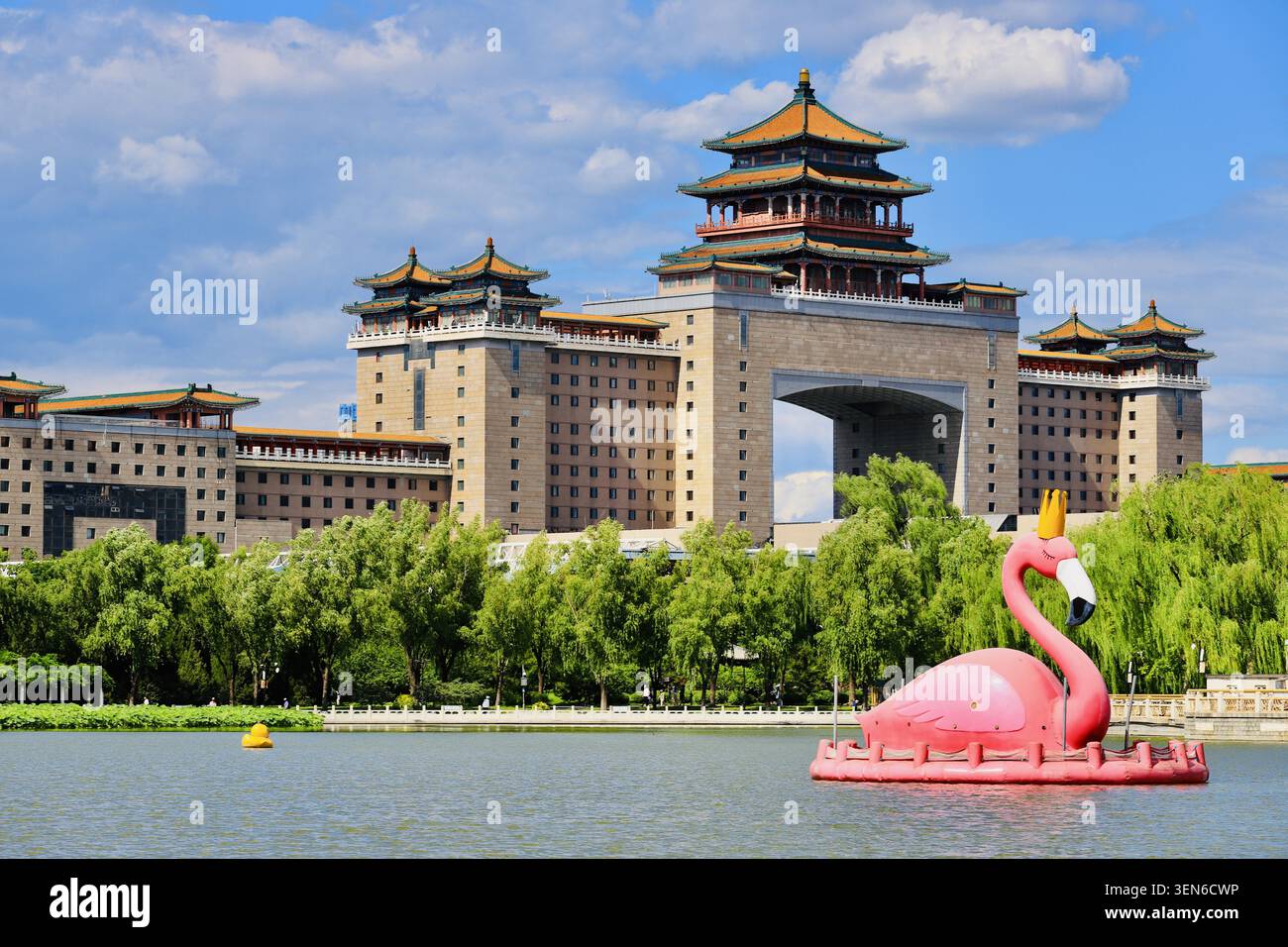 Visitors enjoy the ecological scenery with swans flying and lotuses ...