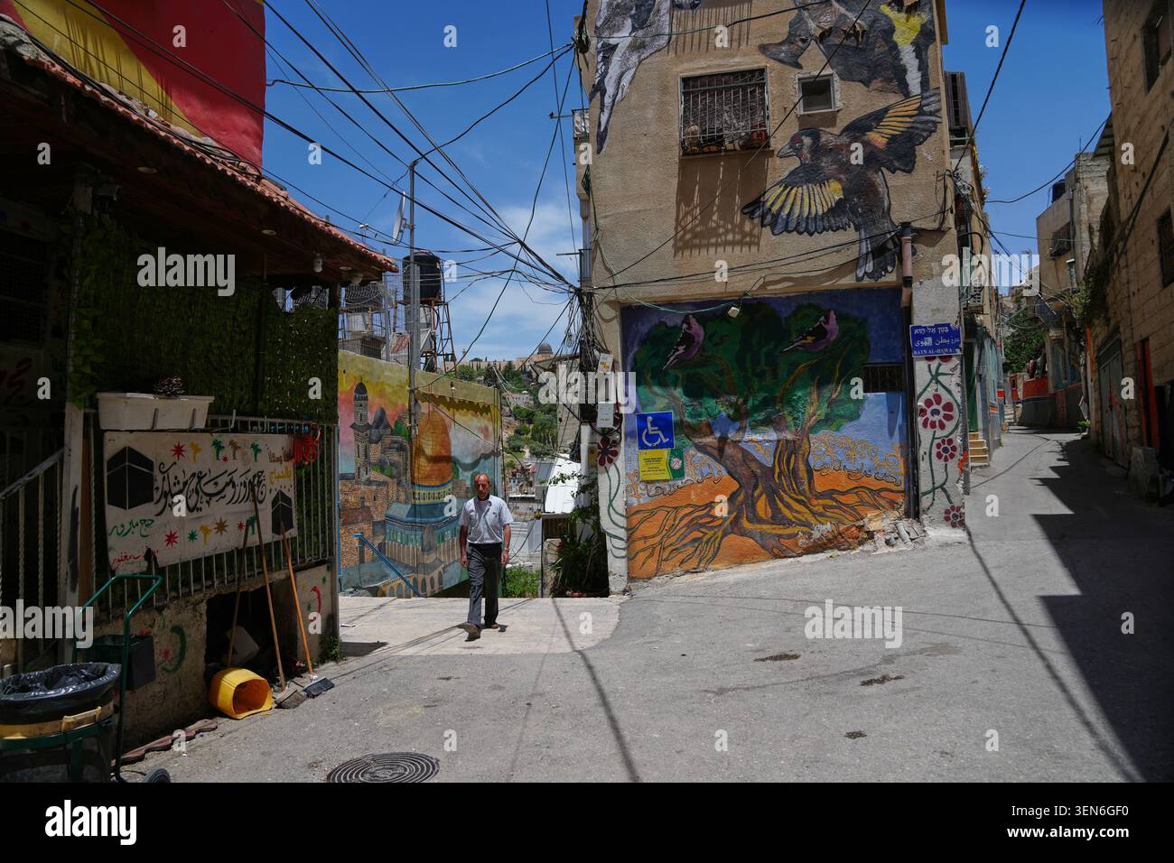 Palestinian Khalil Basbous walks through his neighborhood in Silwan, in ...