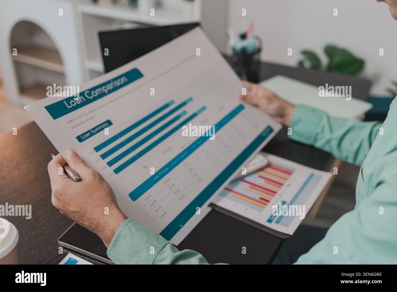 Business professional analyzing financial reports, reviewing ...