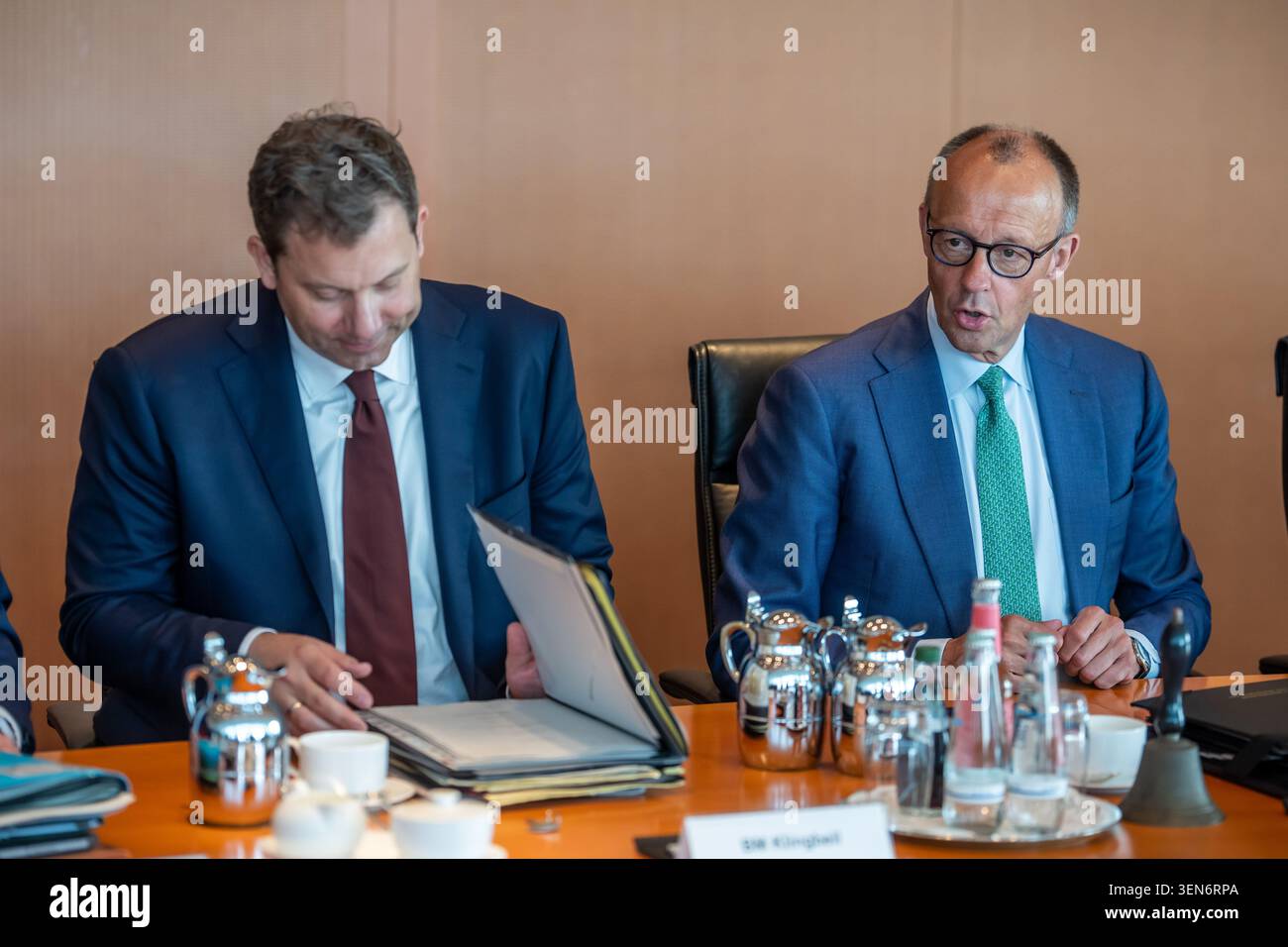 10 June 2026, Berlin: Federal Chancellor Friedrich Merz (r, CDU) speaks ...