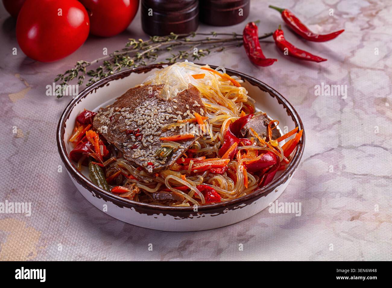 Stir fried glass noodles with beef, carrots, red peppers and sesame ...