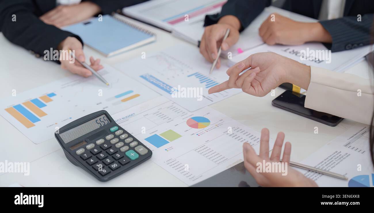 Asian business team collaborating on financial planning and budgeting ...