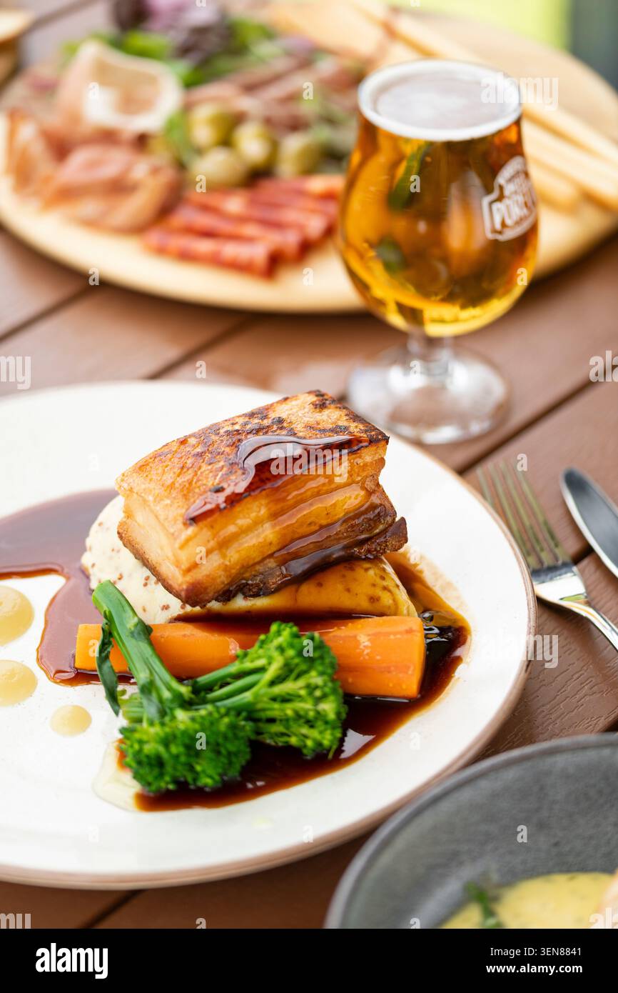 Delicious Pork Belly Served on a Bed of Vegetables With a Refreshing ...