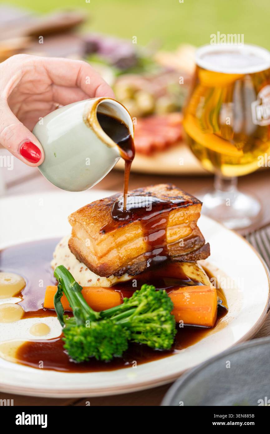 Delicious Gourmet Pork Belly Served With Vibrant Vegetables and Rich ...