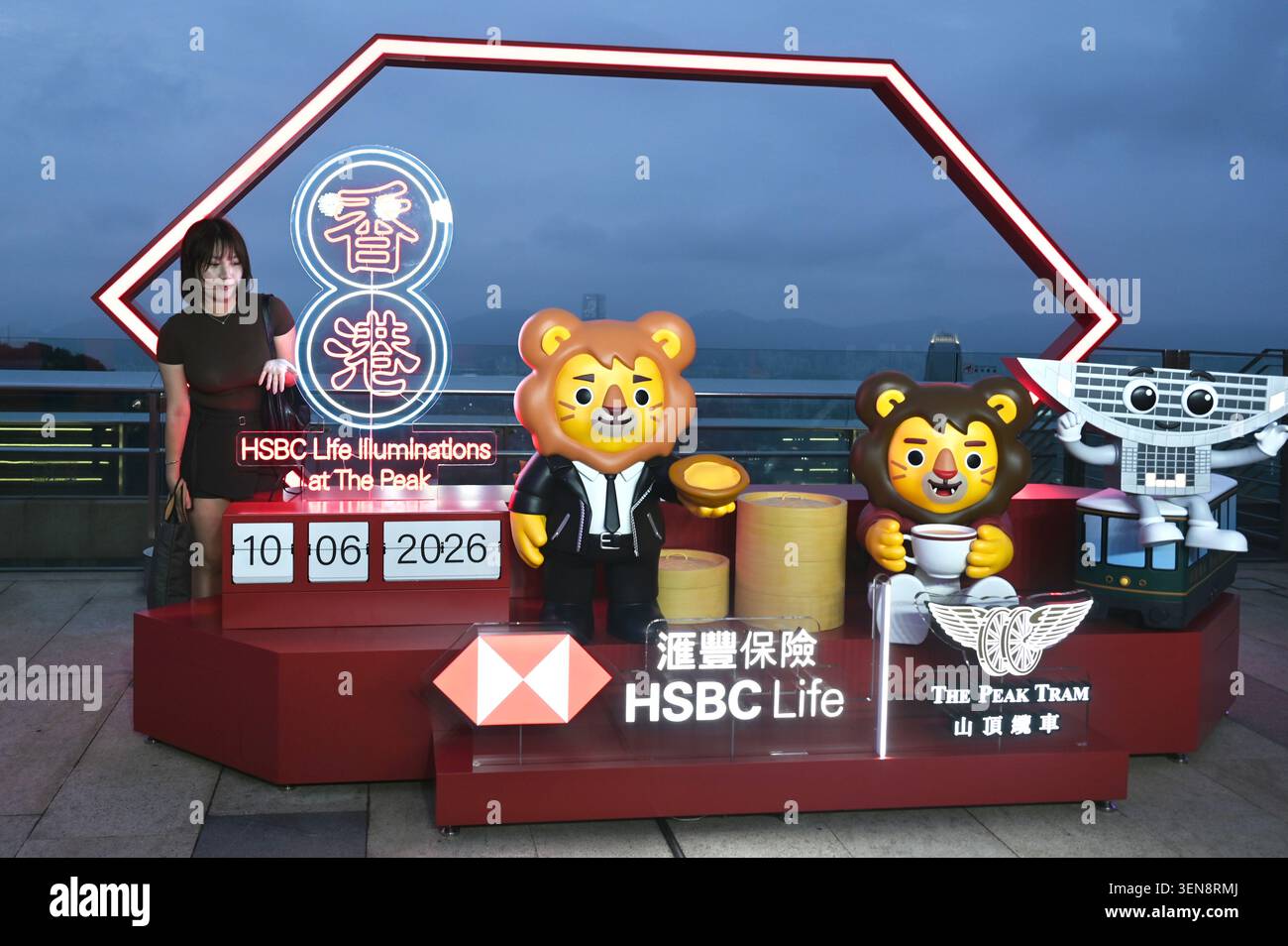 A lady posing photo with a exhibit of HSBC Life Illuminations at The ...