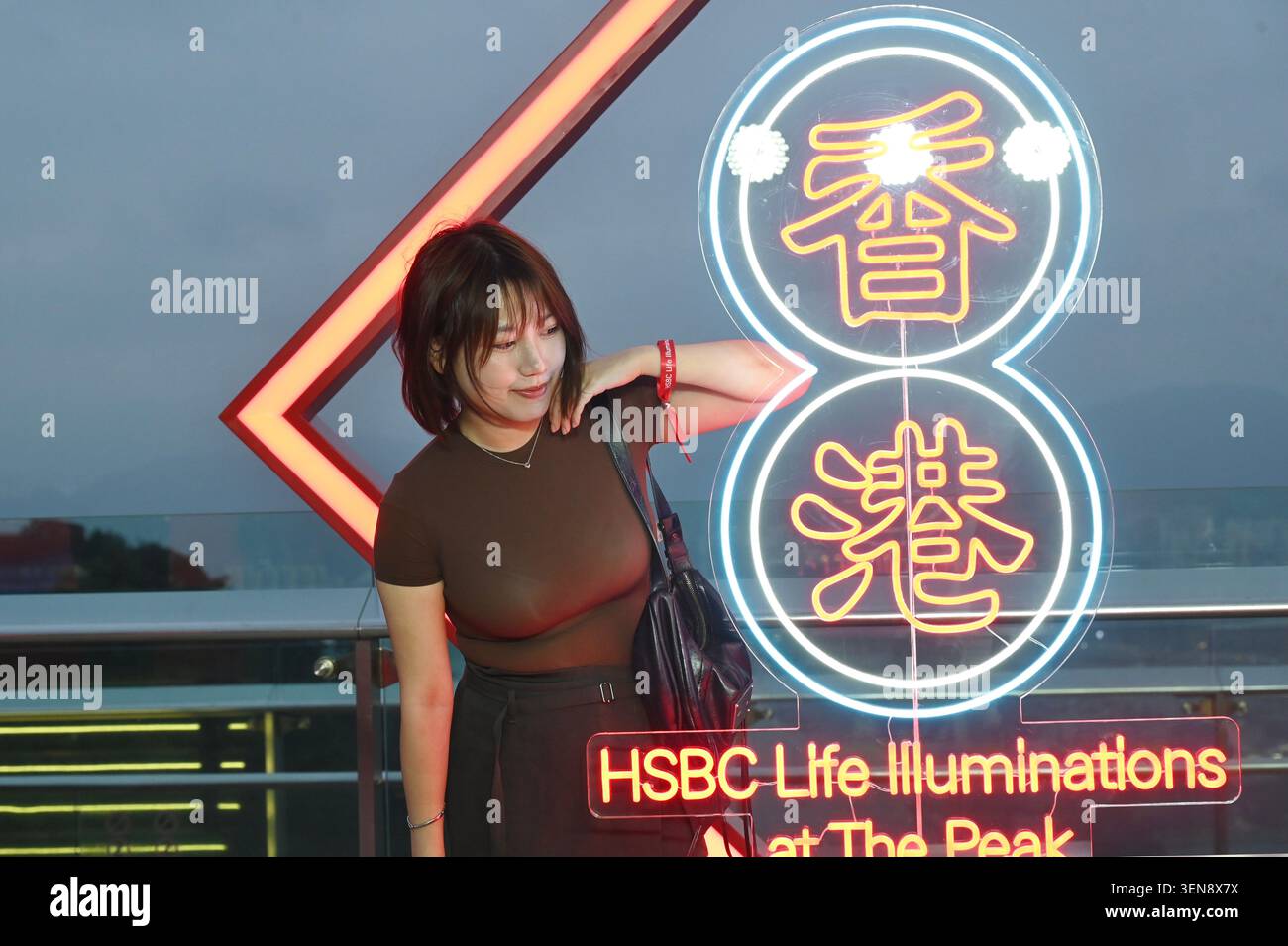 A lady posing photo with a exhibit of HSBC Life Illuminations at The ...
