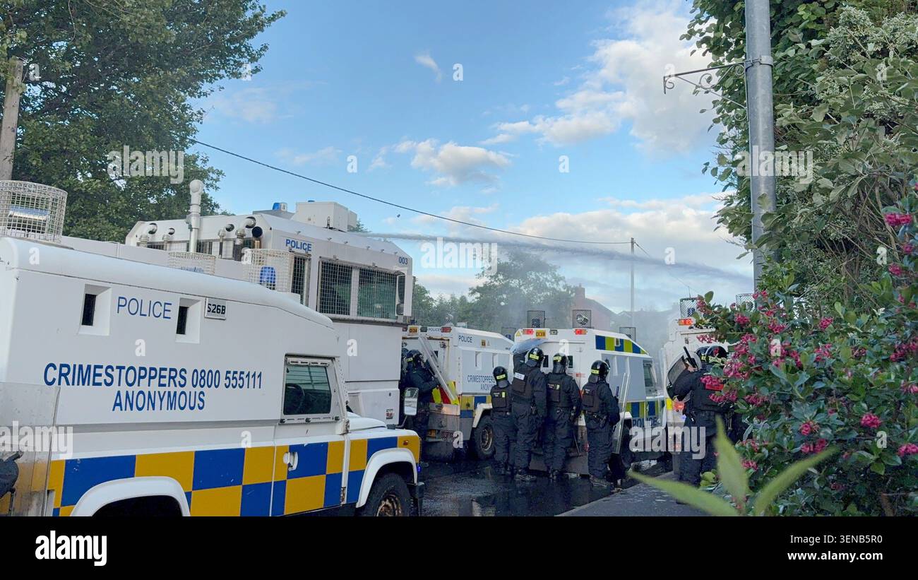 Police fire water cannons at protesters near the Sandyknowes roundabout ...
