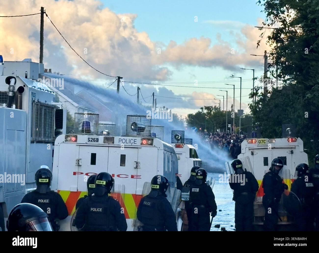 Police fire water cannons at protesters near the Sandyknowes roundabout ...