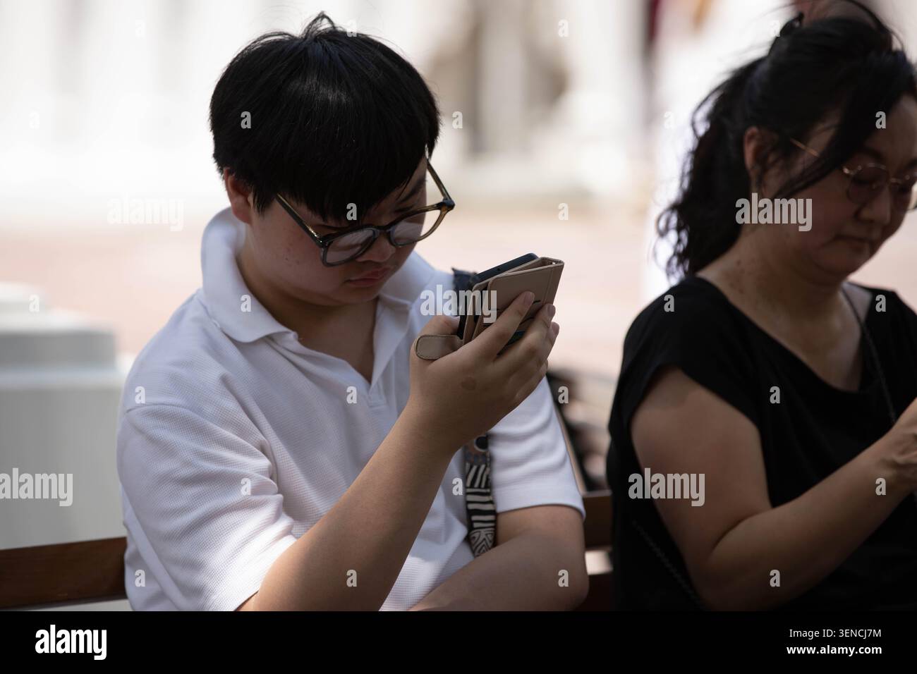 BANGKOK, THAILAND - MAY 23, 2026: Male tourist using smartphone, front ...