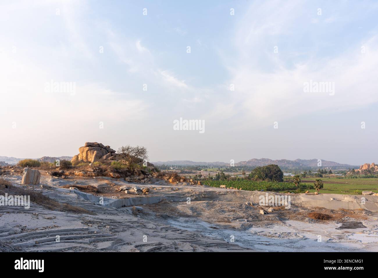 Rock Outcrop and Quarry Landscape with Green Farmland and Hills in ...