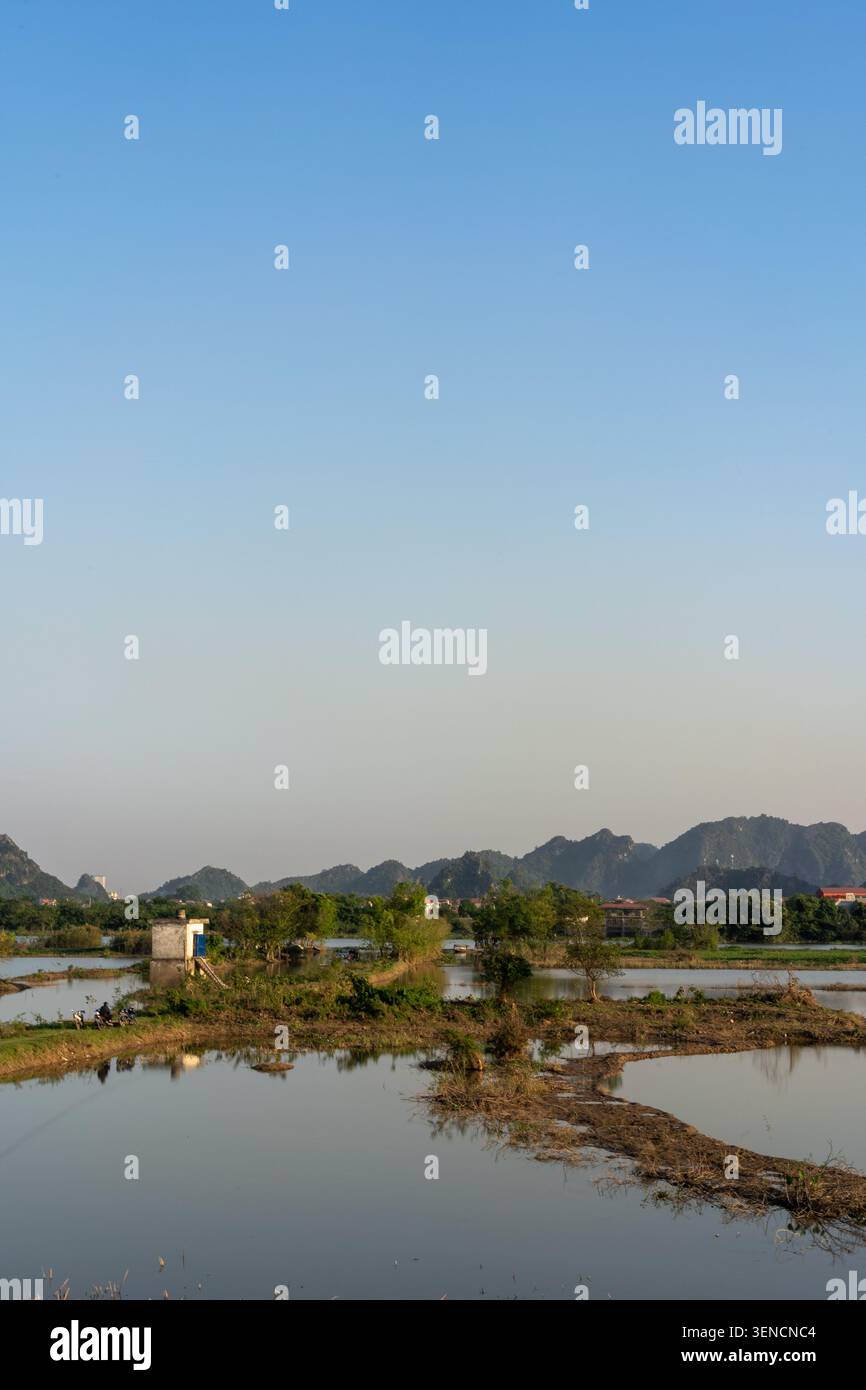 Rural Wetlands and Limestone Mountains in Ninh Binh, Vietnam Stock ...