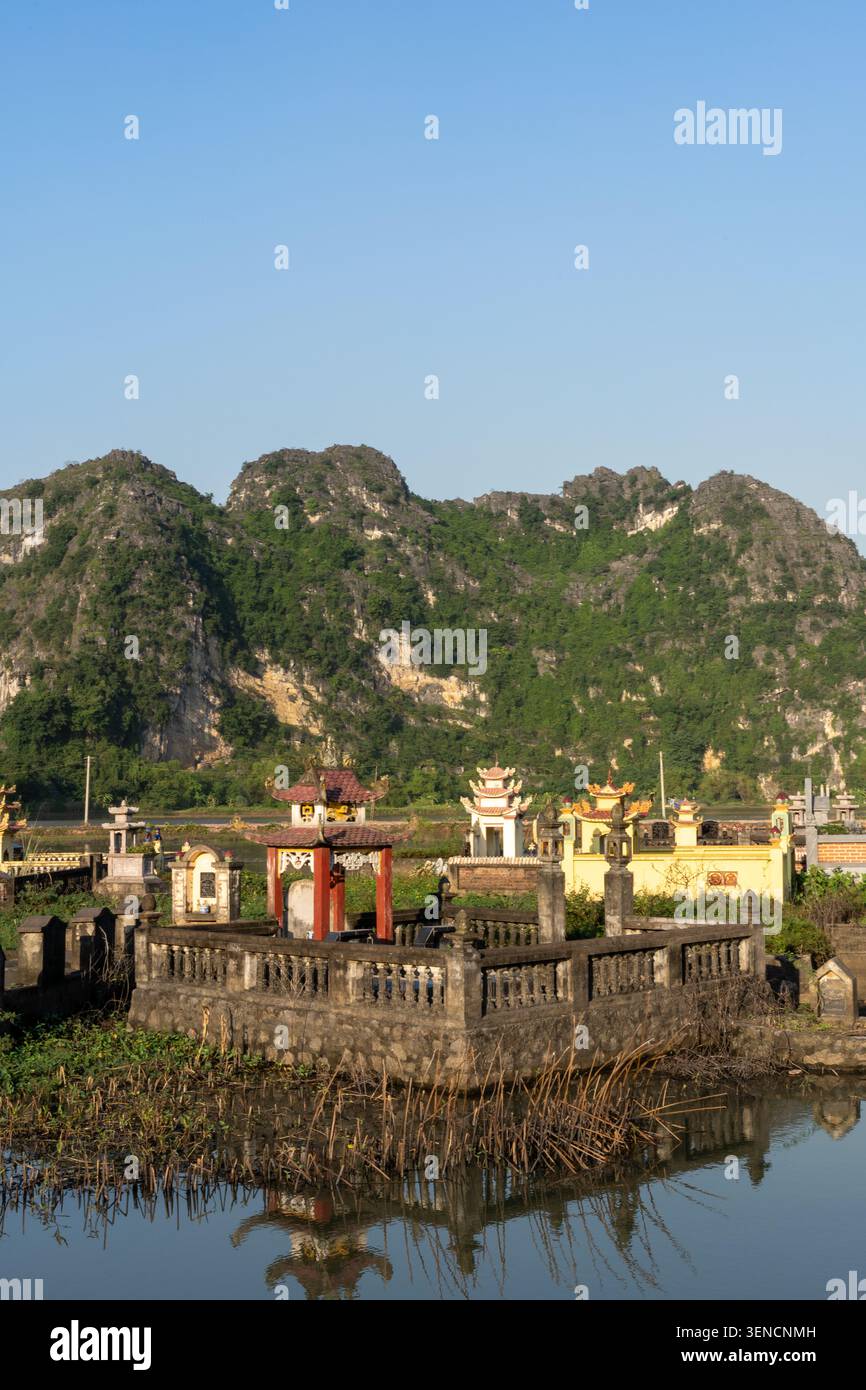 Ninh Binh, Vietnam - November 21, 2025: Traditional Vietnamese cemetery ...