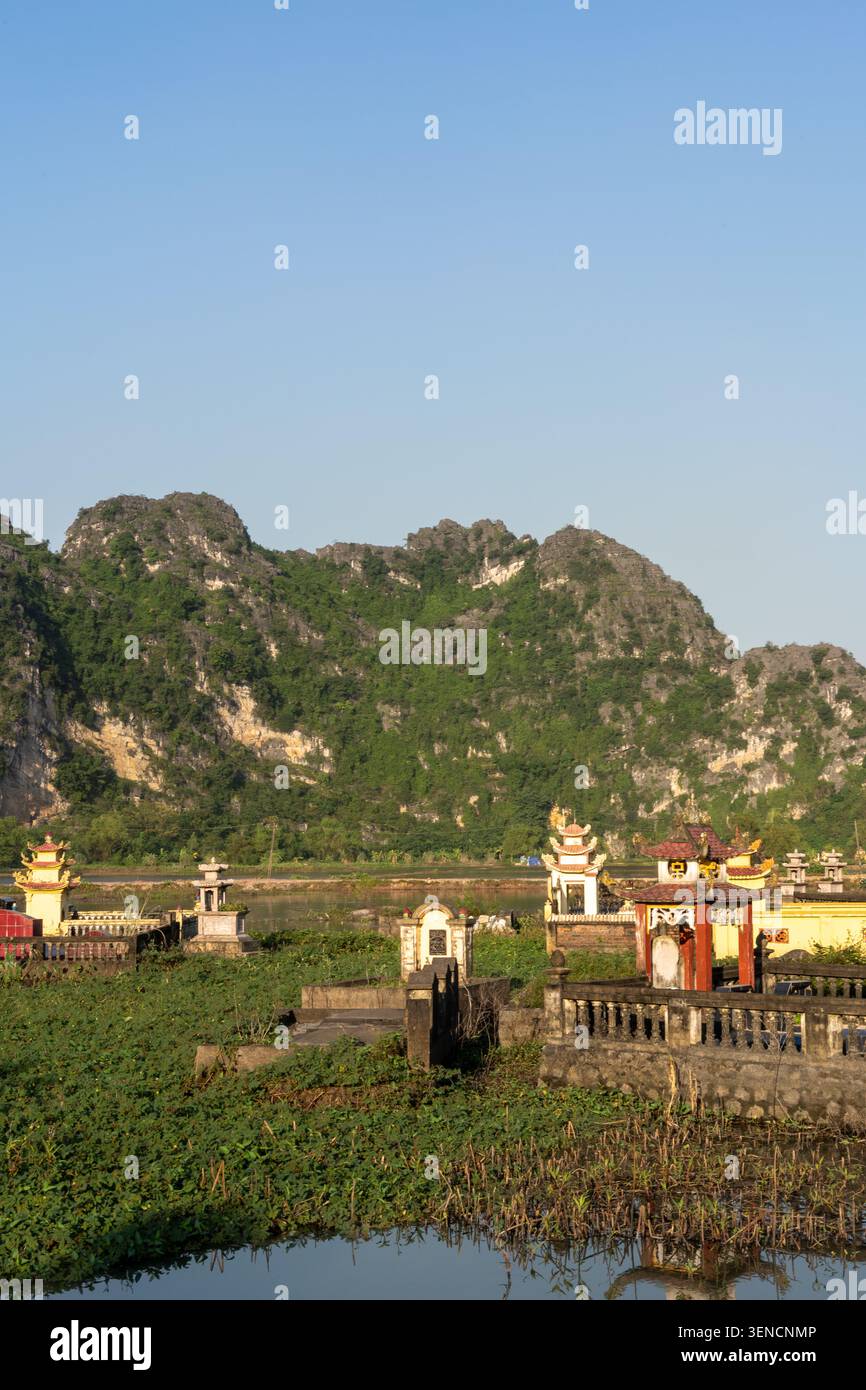 Ninh Binh, Vietnam - November 21, 2025: Traditional Vietnamese cemetery ...