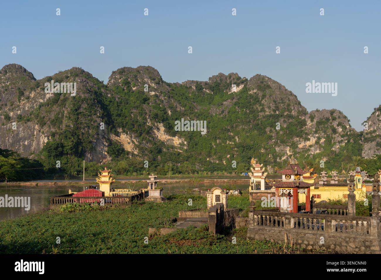 Ninh Binh, Vietnam - November 21, 2025: Traditional Vietnamese cemetery ...