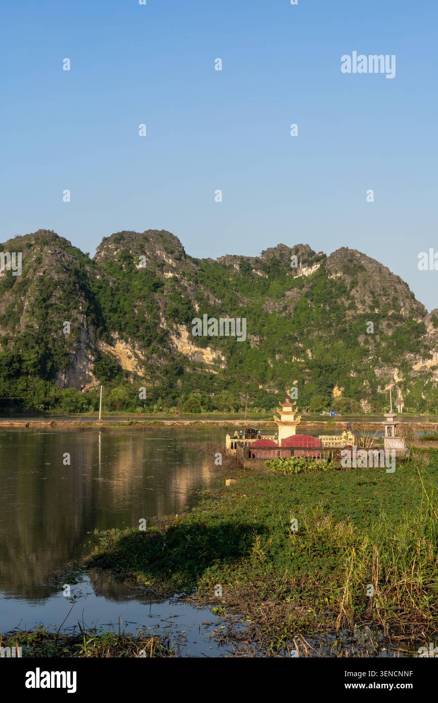 Ninh Binh, Vietnam - November 21, 2025: Traditional Vietnamese cemetery ...