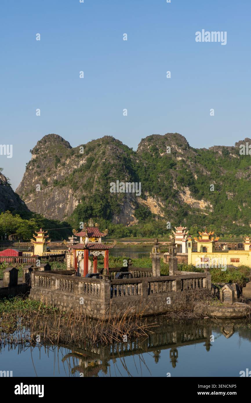 Ninh Binh, Vietnam - November 21, 2025: Traditional Vietnamese cemetery ...