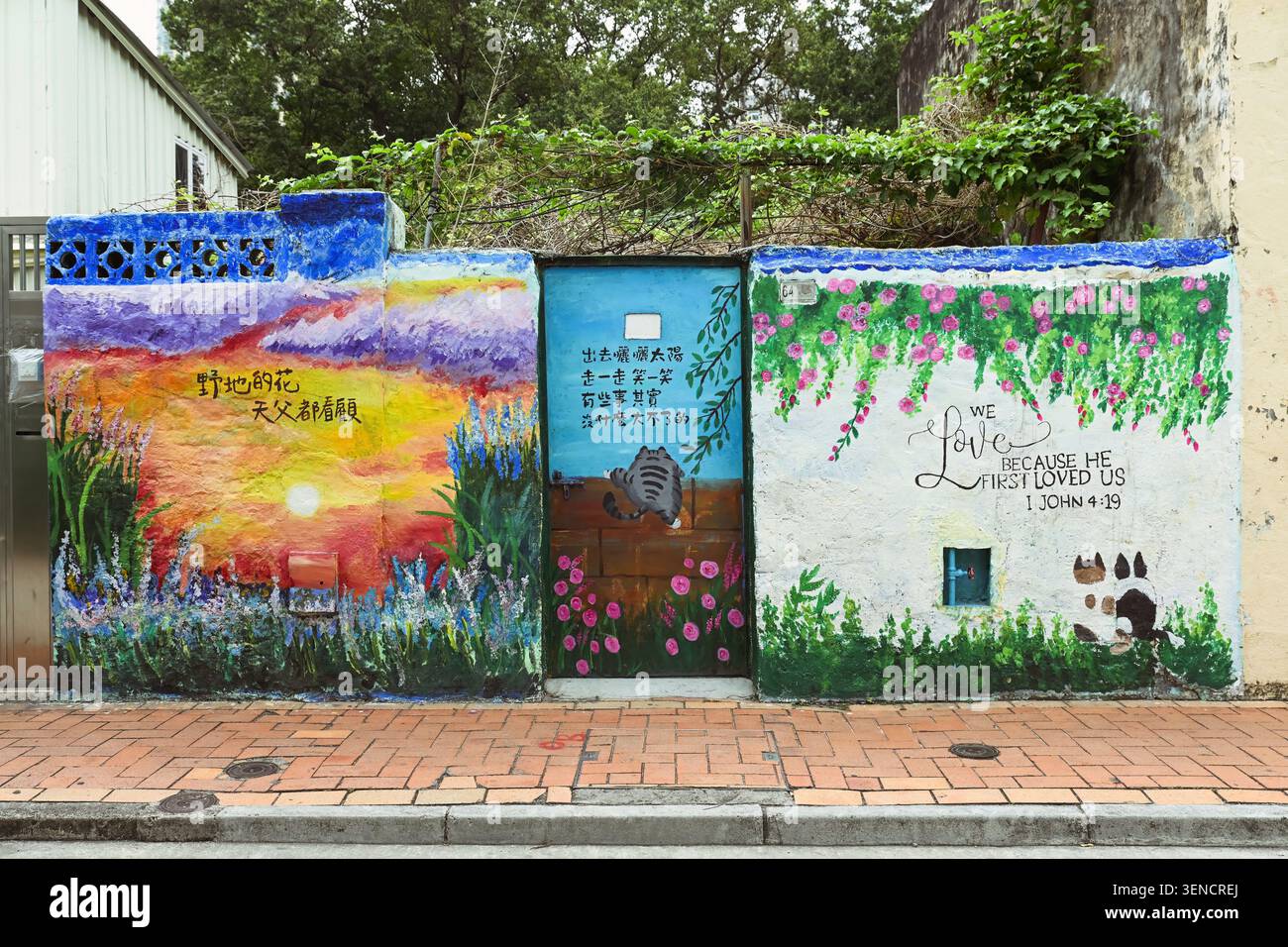 MACAU, CHINA, APRIL 2, 2026 Colorful street art mural painting with cat ...