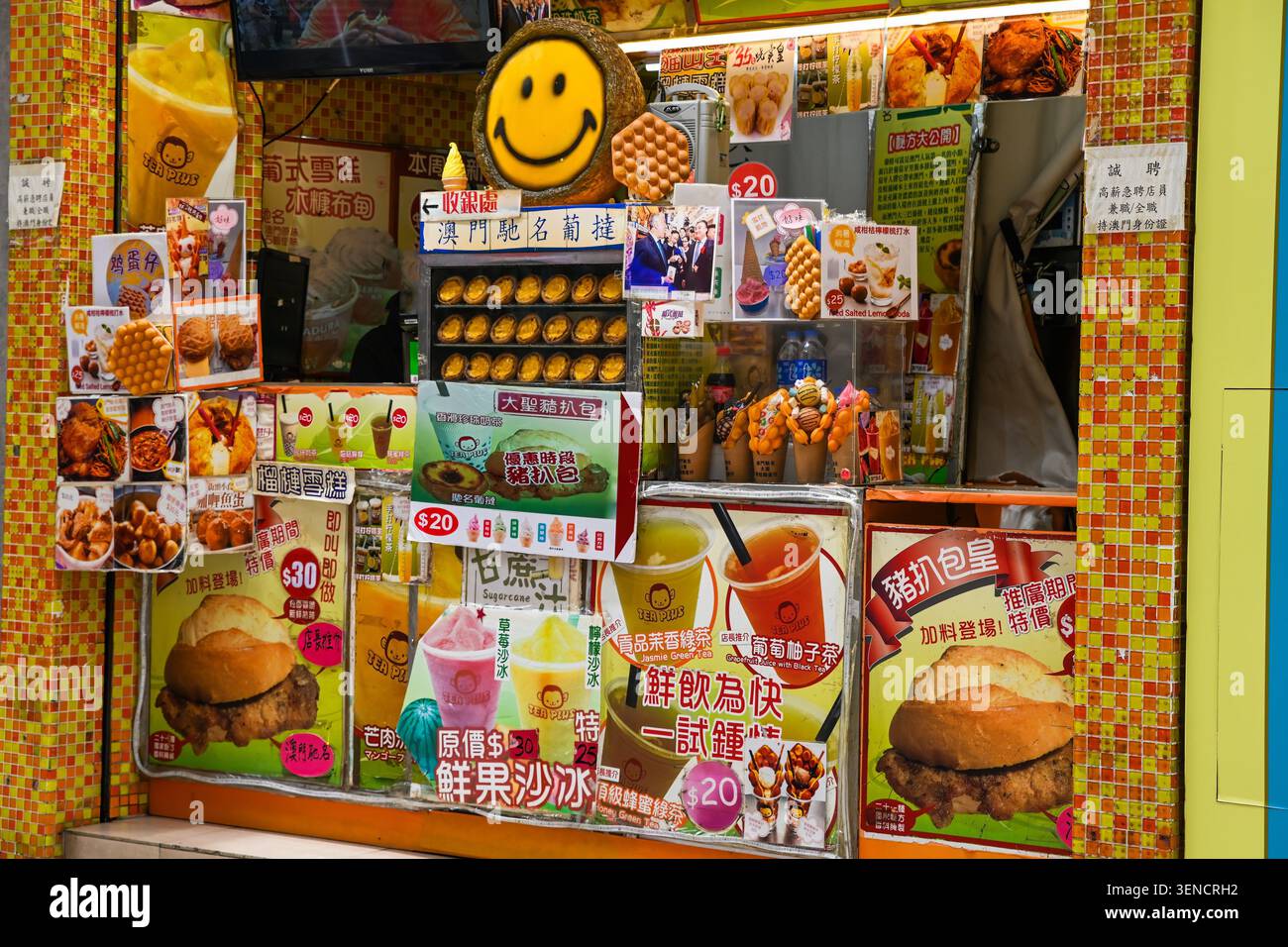Macau, China April 13, 2026 Street food stall window decorated with ...