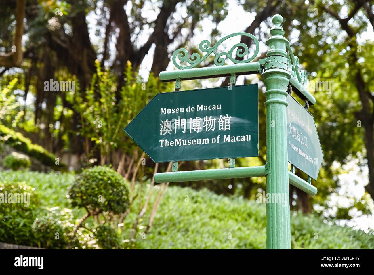 Macau, China April 13, 2026 Green street sign pointing towards The ...