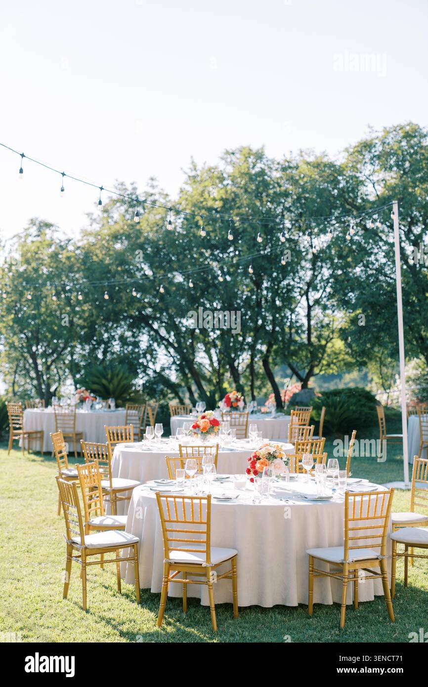 Elegant outdoor wedding reception with decorated tables Stock Photo - Alamy