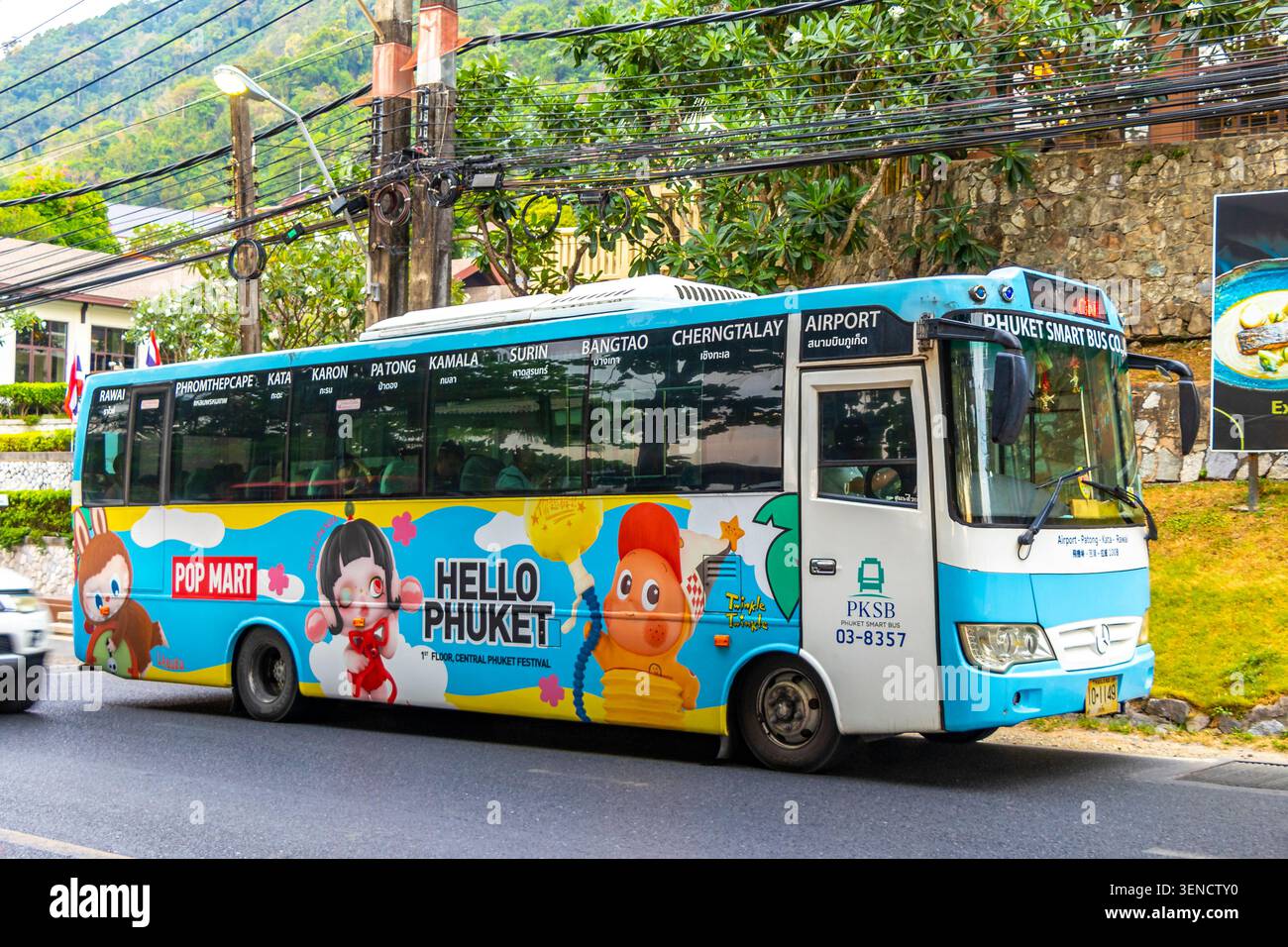 Blue Smart Bus driving through tropical city streets with palm trees ...