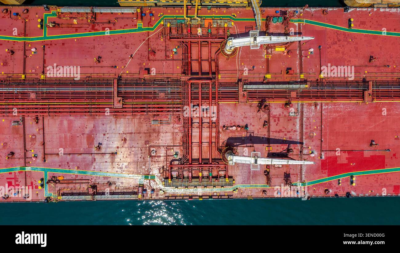 An oil tanker unloads imported crude oil at the oil port terminal of ...