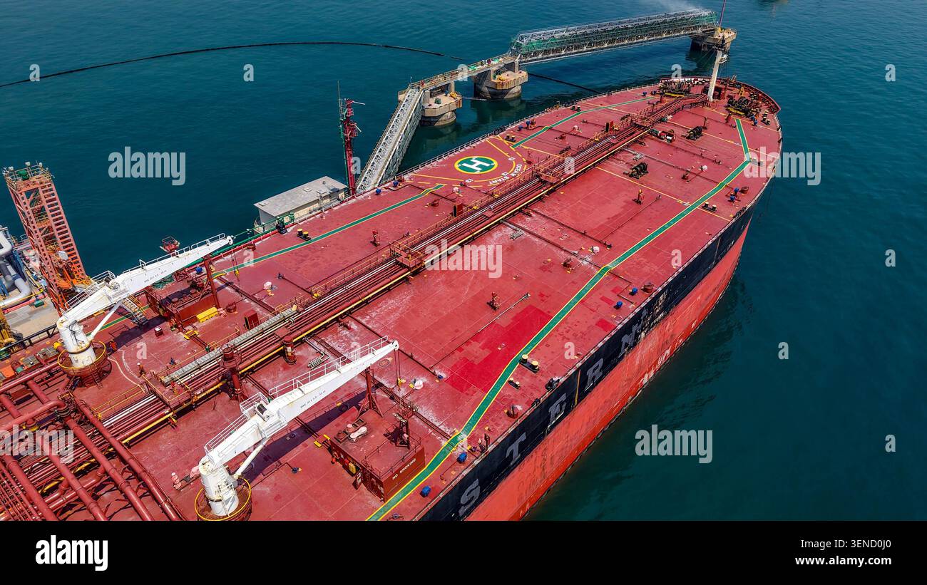 An oil tanker unloads imported crude oil at the oil port terminal of ...