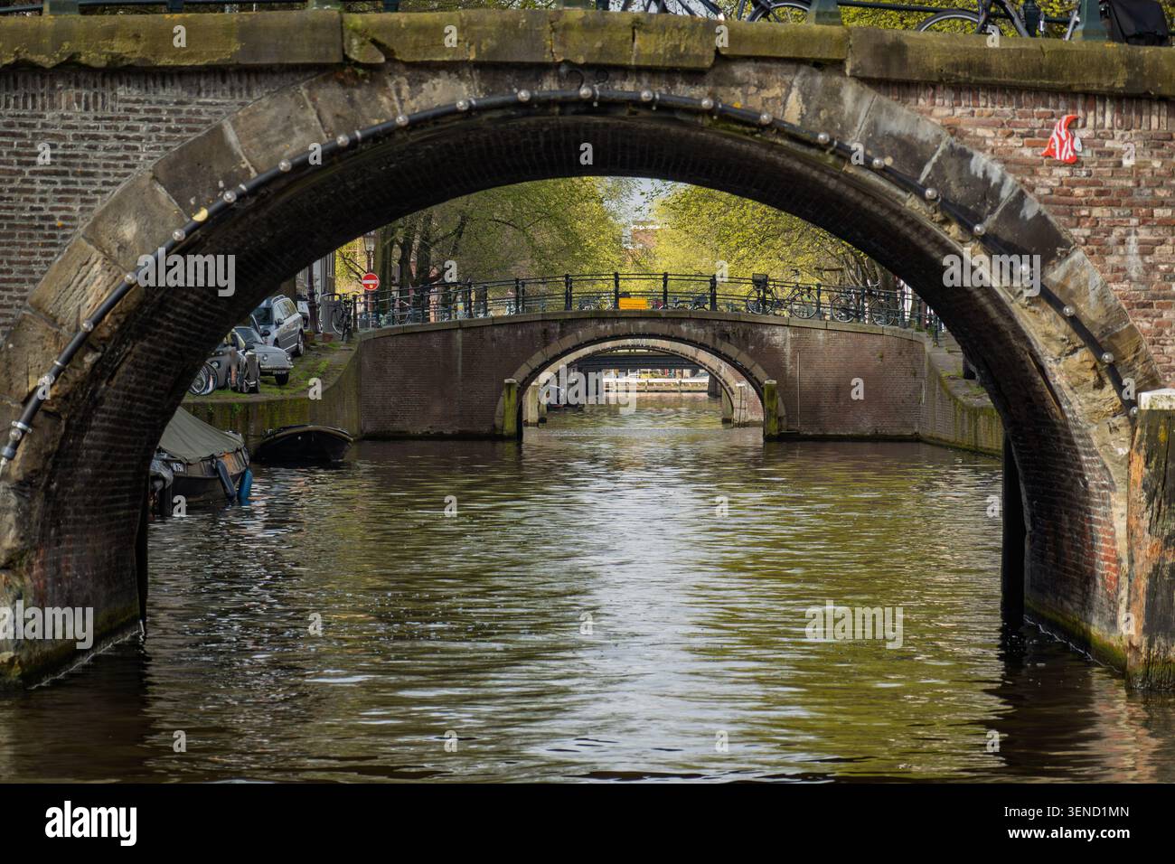 AMSTERDAM, NETHERLANDS - APRIL 1, 2026: Multiple historic stone arch ...