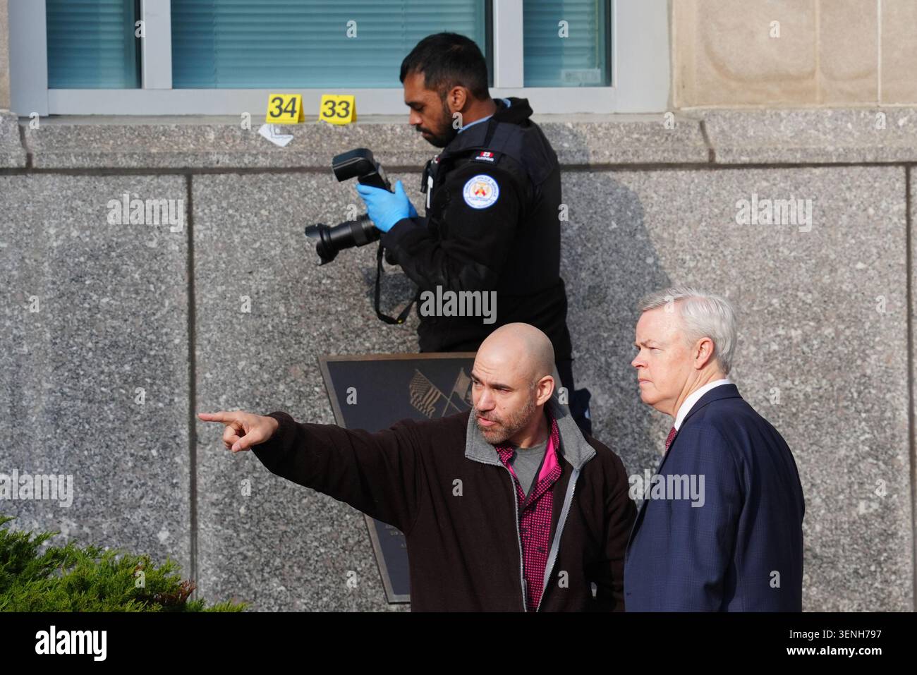 FILE - Consulate officials speak together as a Toronto forensic officer ...