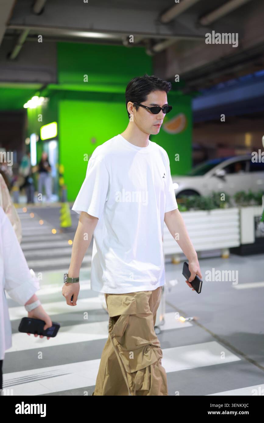 Chinese singer Ayanga wears white T-shirt with cargo pants at Shanghai ...