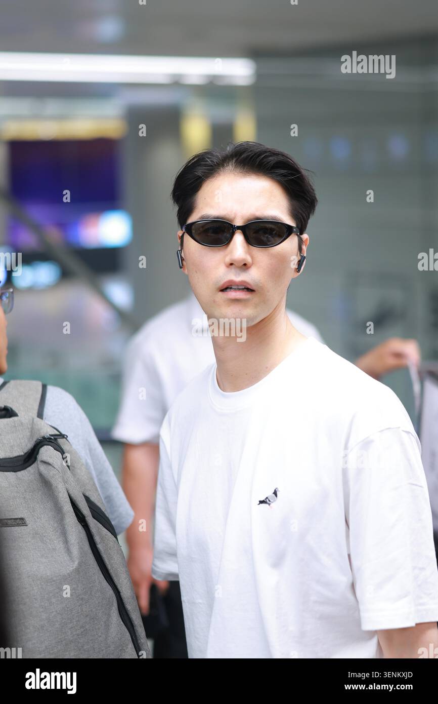 Chinese singer Ayanga wears white T-shirt with cargo pants at Shanghai ...