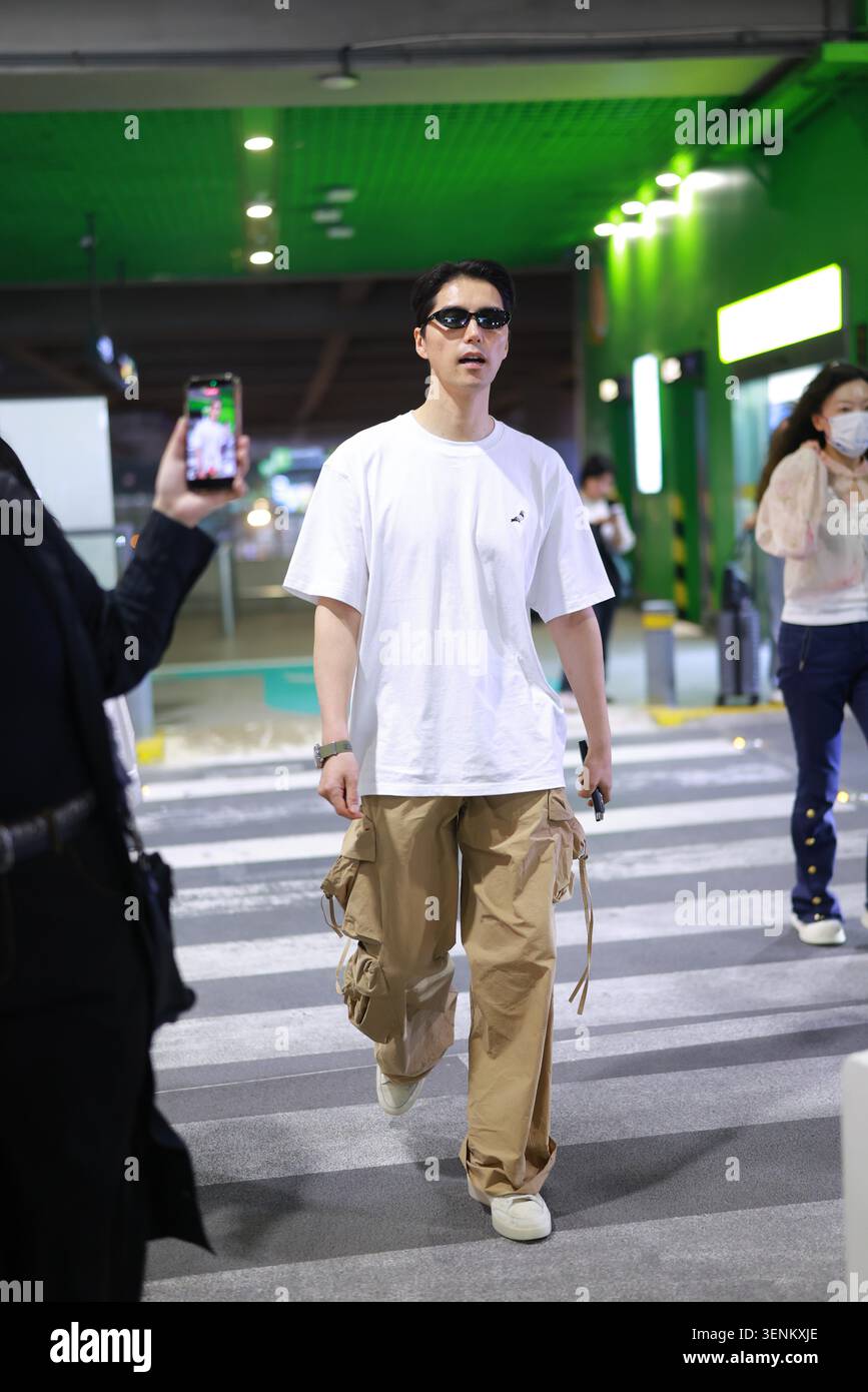 Chinese singer Ayanga wears white T-shirt with cargo pants at Shanghai ...