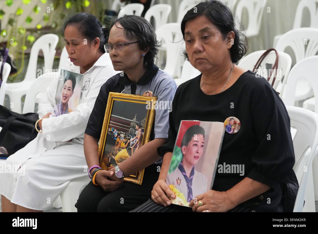 Peoples hold pictures of Thailand's Princess Bajrakitiyabha in Bangkok ...
