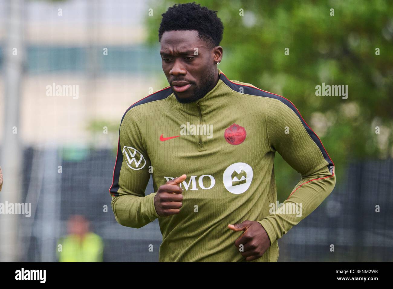 Canadian captain Alphonso Davies runs laps during a World Cup training ...