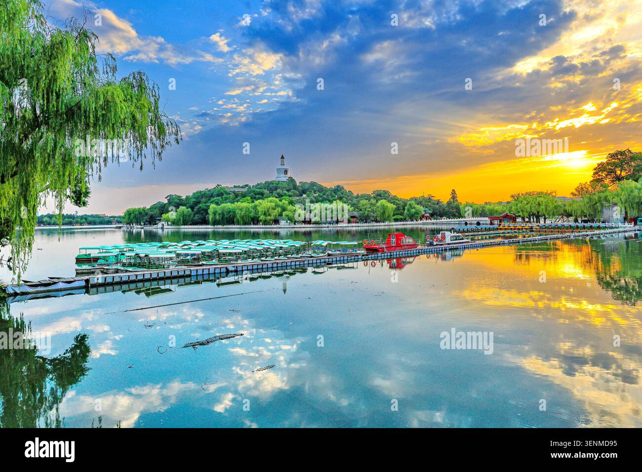 Morning glow illuminates the White Pagoda at Beihai Park in Beijing, 12 ...