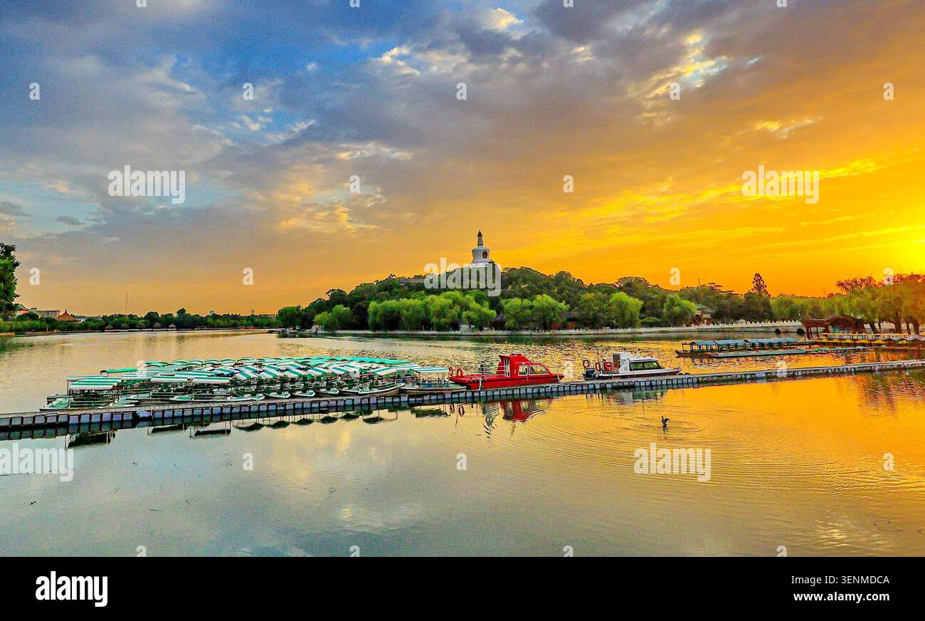 Morning glow illuminates the White Pagoda at Beihai Park in Beijing, 12 ...