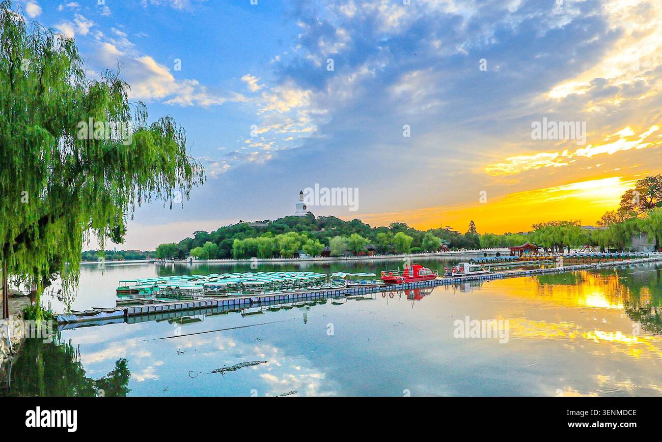 Morning glow illuminates the White Pagoda at Beihai Park in Beijing, 12 ...
