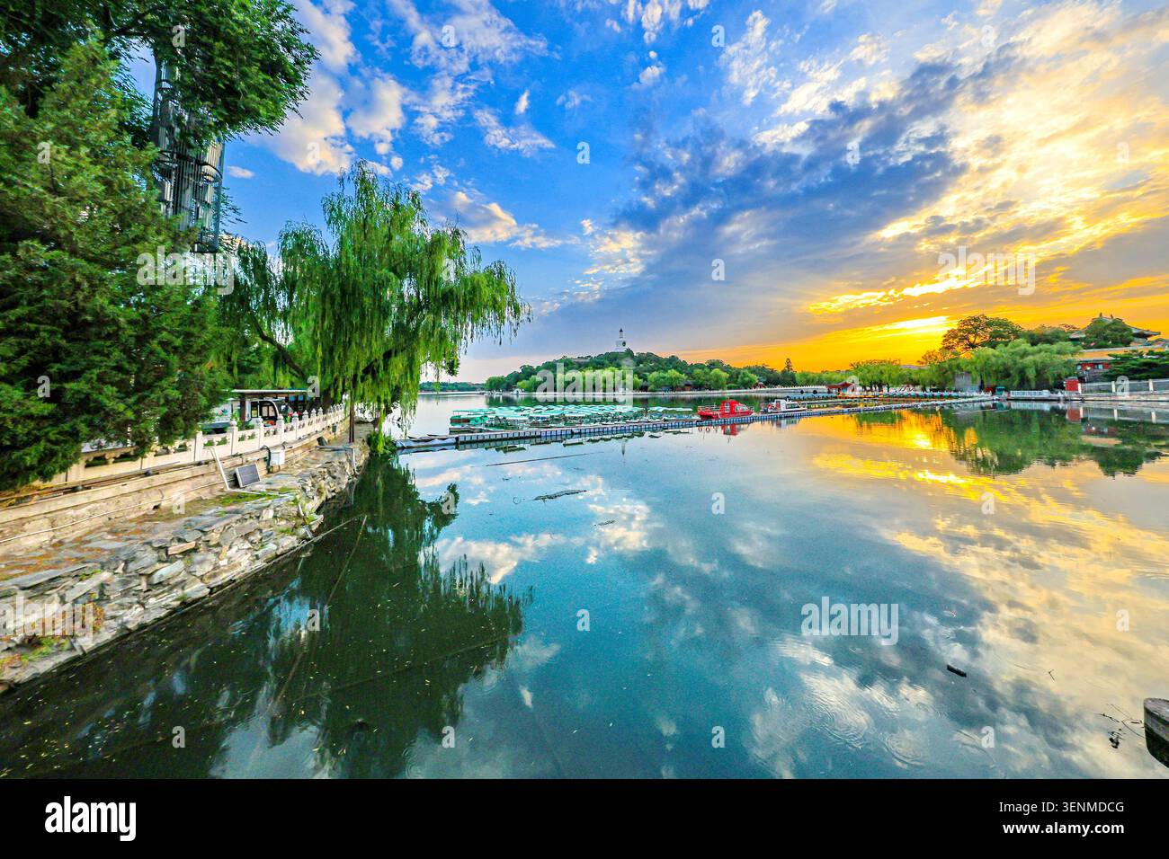 Morning glow illuminates the White Pagoda at Beihai Park in Beijing, 12 ...