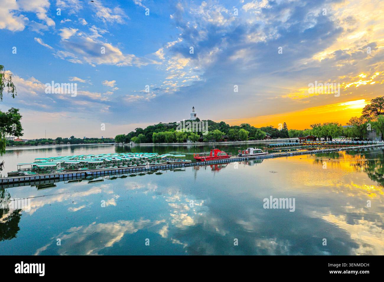 Morning glow illuminates the White Pagoda at Beihai Park in Beijing, 12 ...
