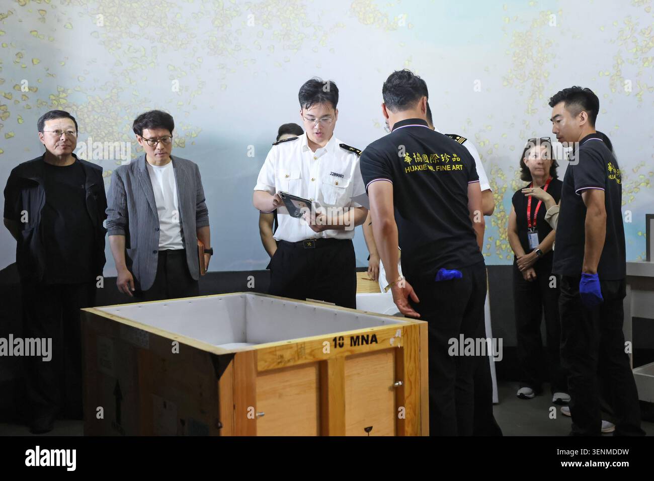 Shanghai Museum staff unpack four precious artifacts for the "World ...
