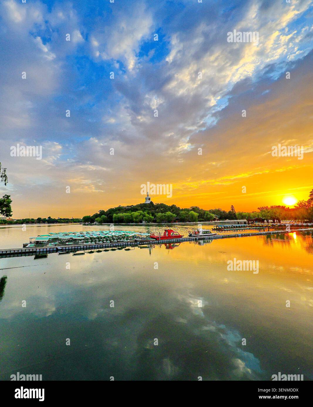 Morning glow illuminates the White Pagoda at Beihai Park in Beijing, 12 ...