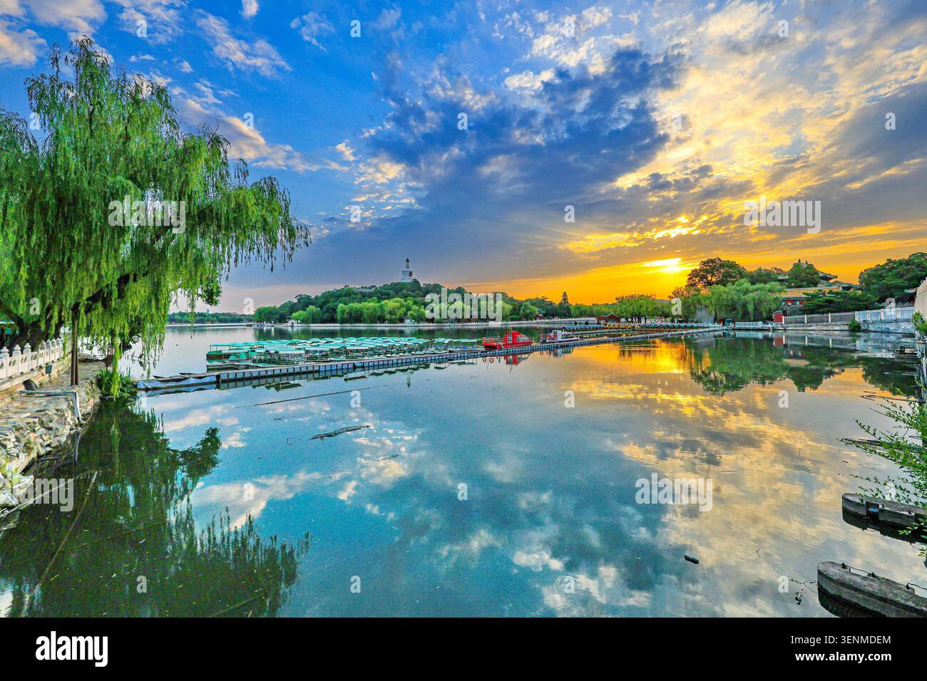 Morning glow illuminates the White Pagoda at Beihai Park in Beijing, 12 ...