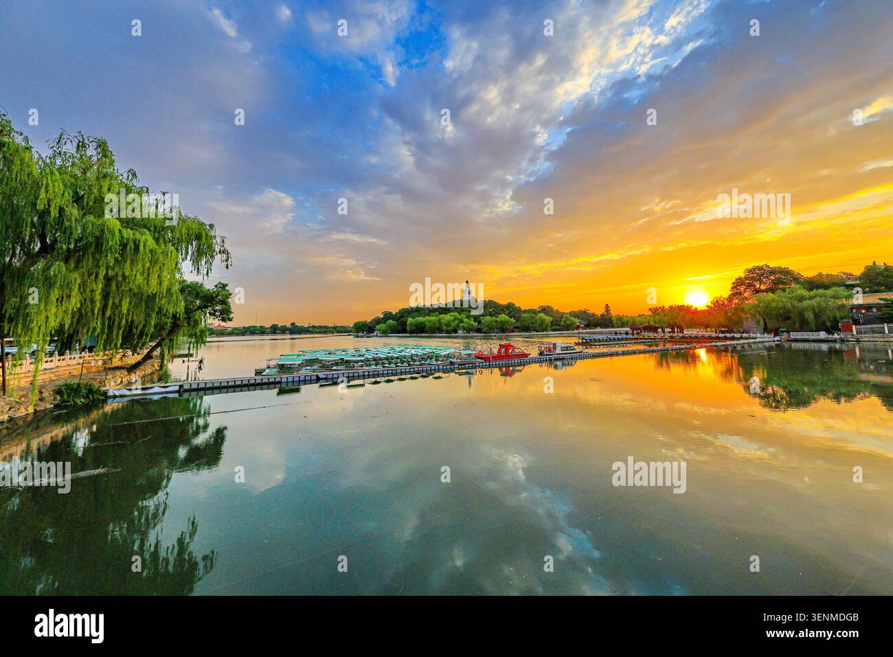 Morning glow illuminates the White Pagoda at Beihai Park in Beijing, 12 ...