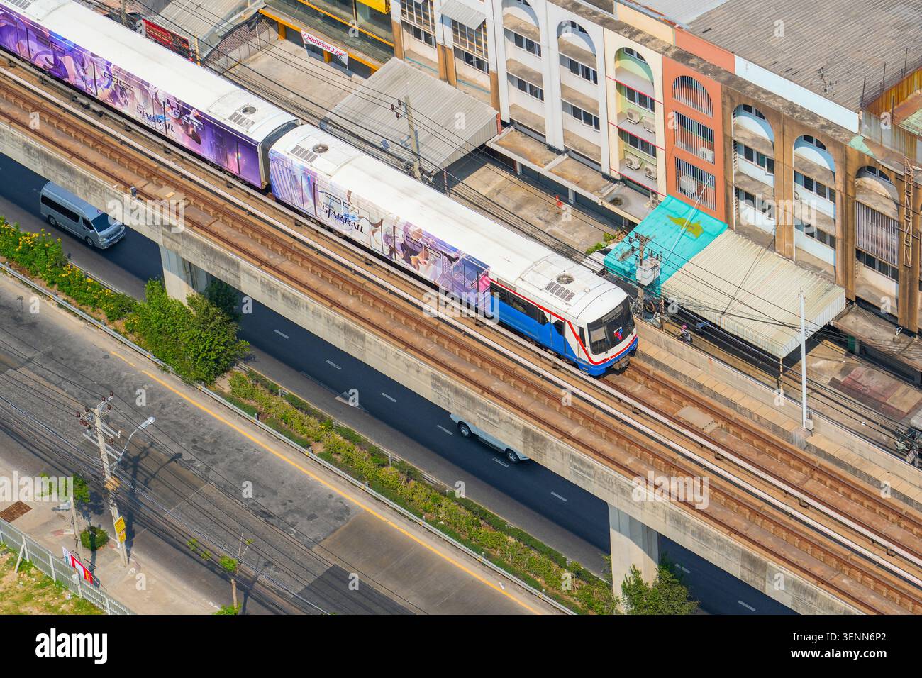Aerial view BTS sky train runs through the street above Sukhumvit road ...