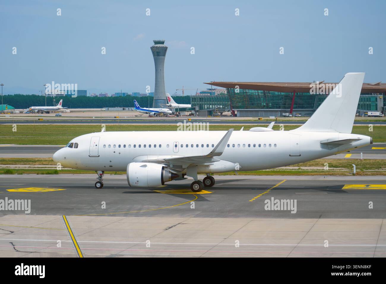 White Airbus a320 taxiing on runway of Kansai Airport, airport Capital ...