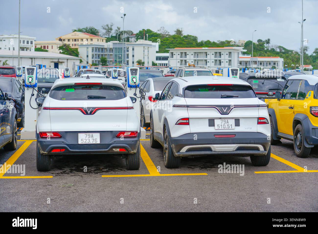 Vinfast electric car row parking and car battery charging base. Vietnam ...